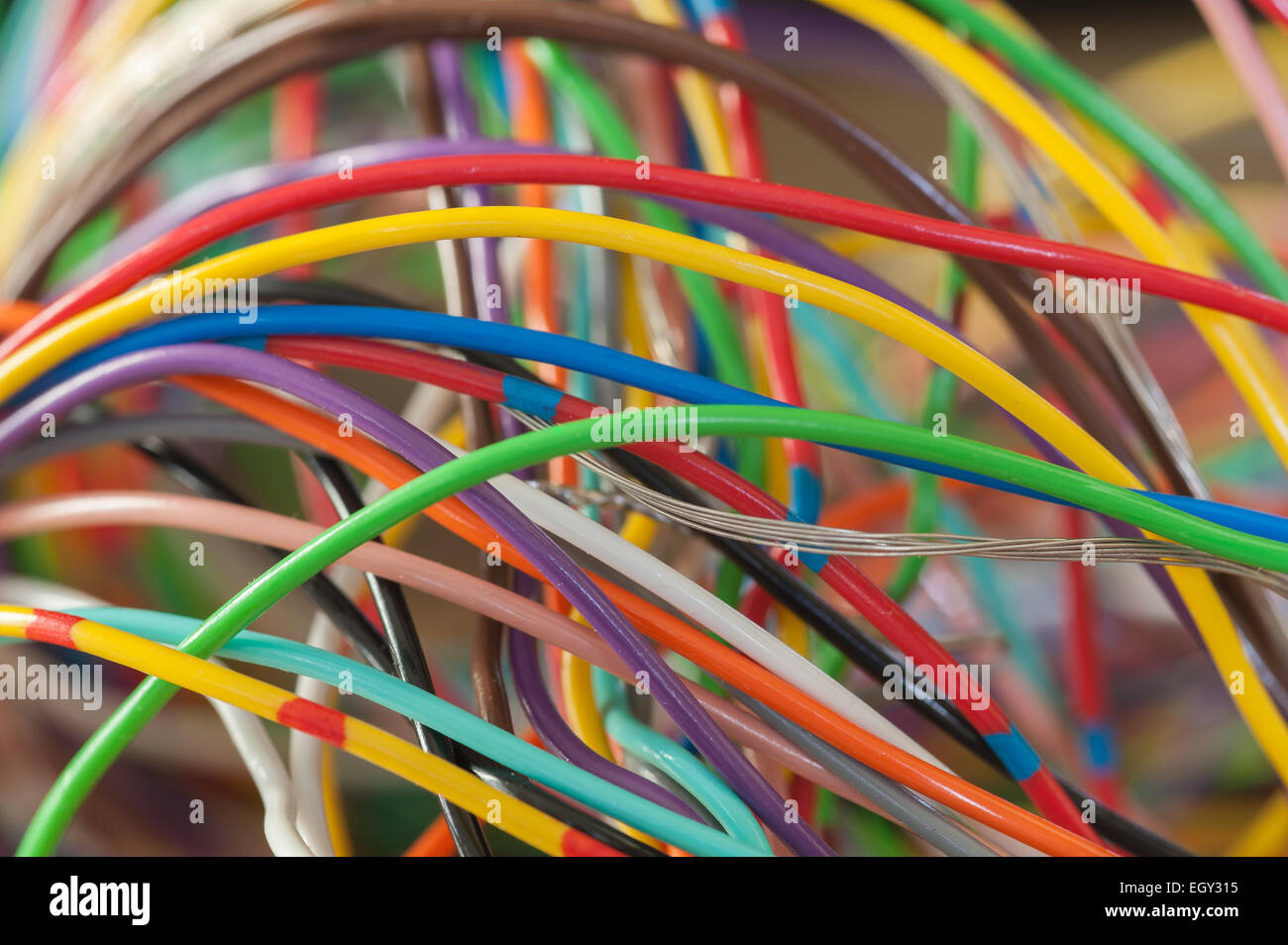 spaghetti junction mass of different colored network computer cables ...