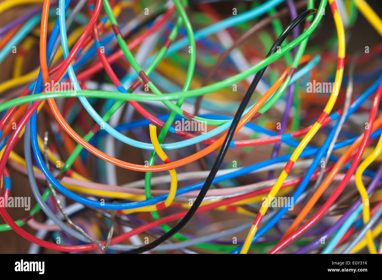 spaghetti junction mass of different colored network computer cables ...