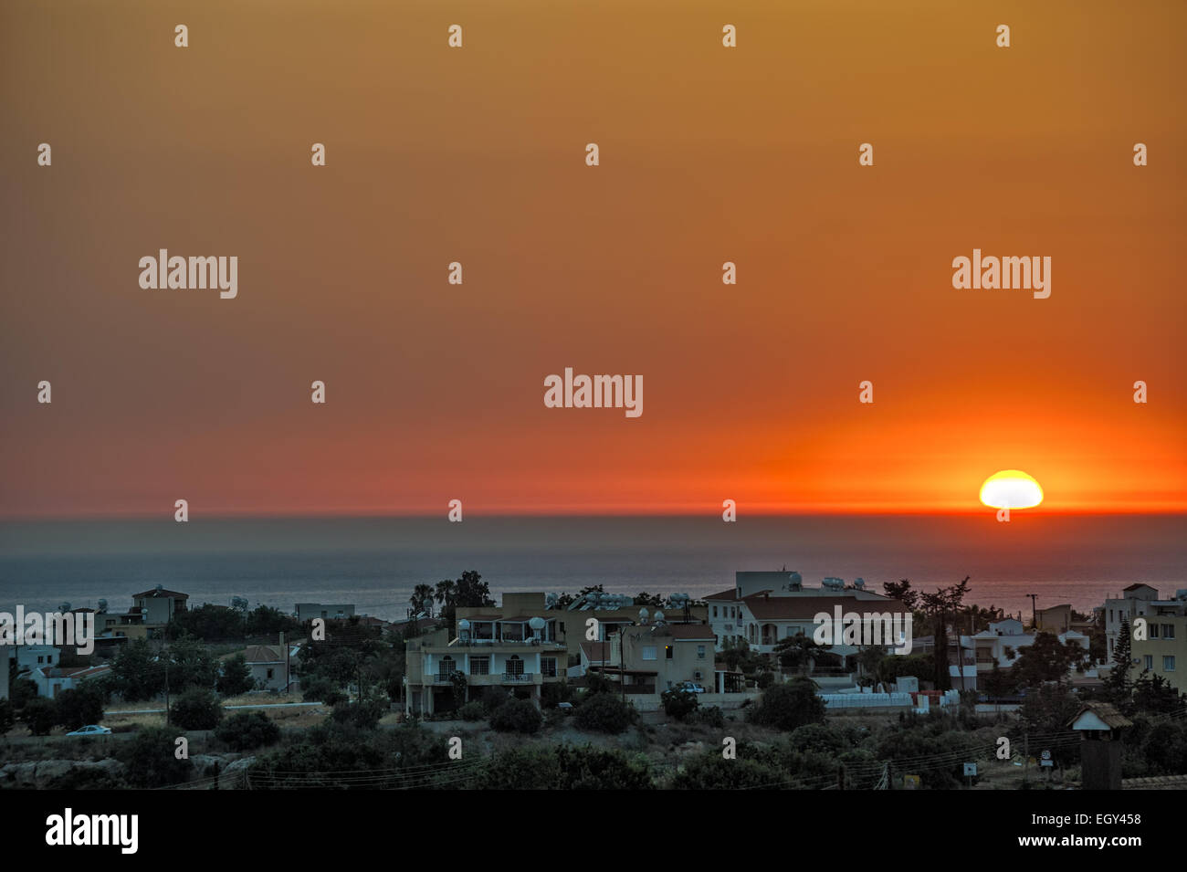 Beautiful sunset over cyprus village on sea coast Stock Photo - Alamy