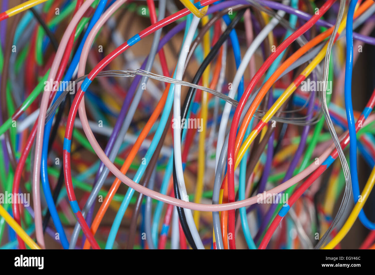 spaghetti junction mass of different colored network computer cables ...