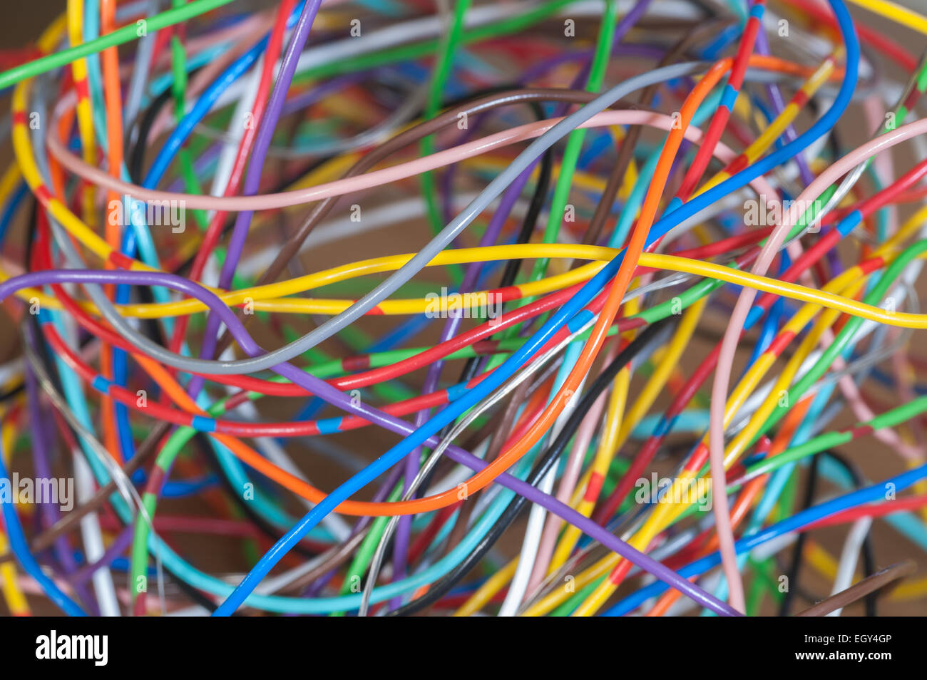 spaghetti junction mass of different colored network computer cables ...