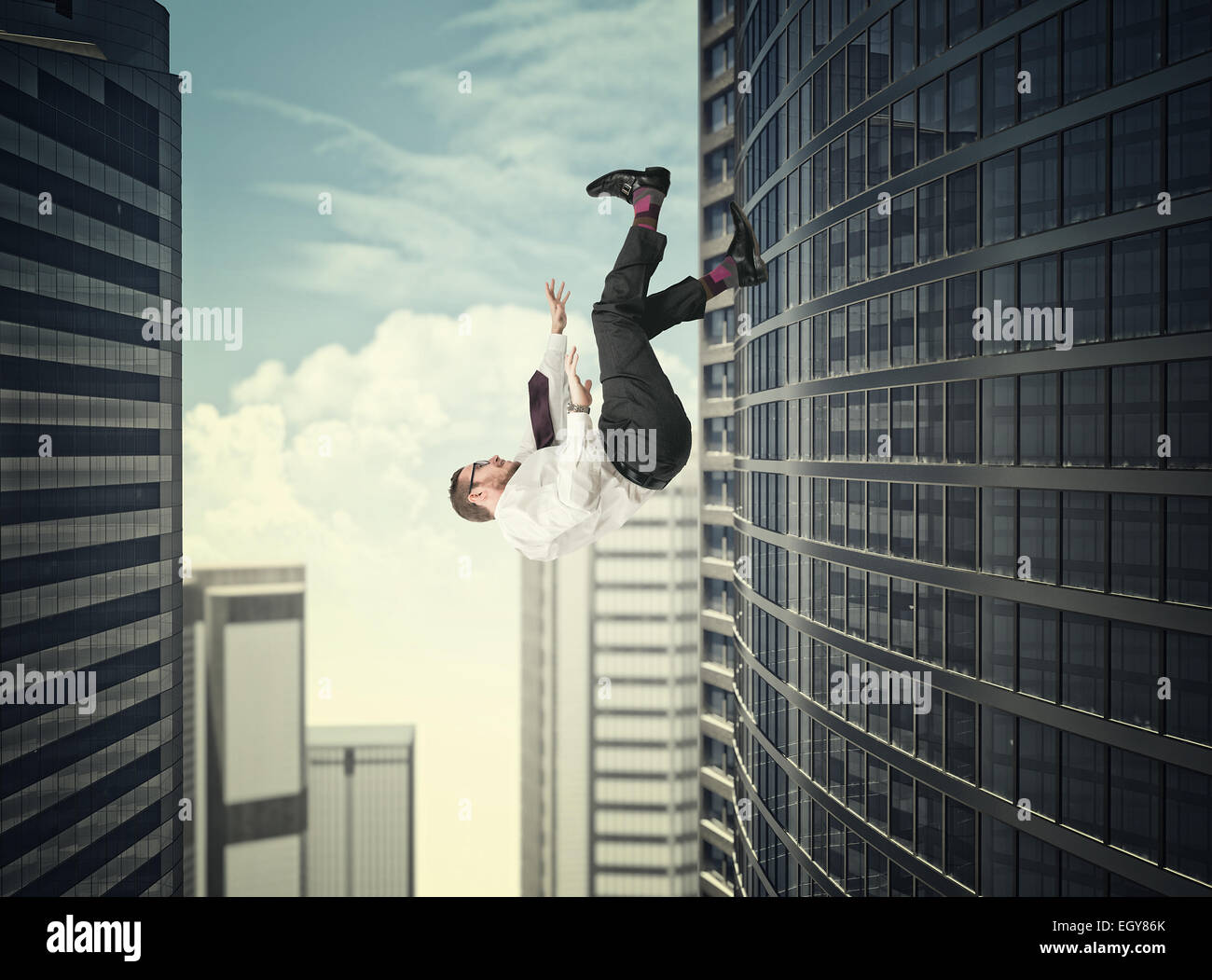 skyscaper background and falling business man Stock Photo - Alamy