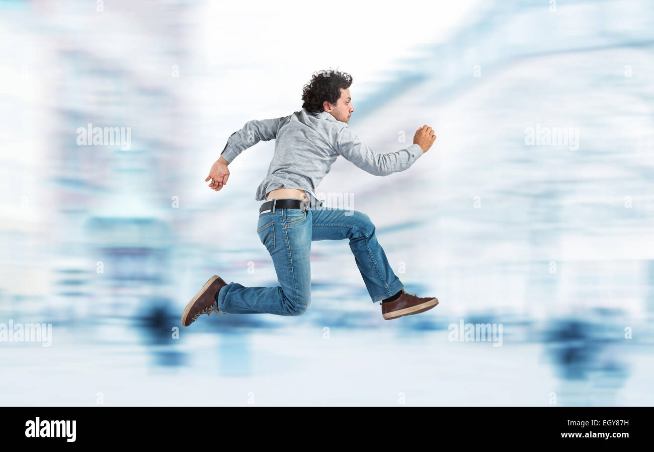 running caucasian man and blur background Stock Photo - Alamy