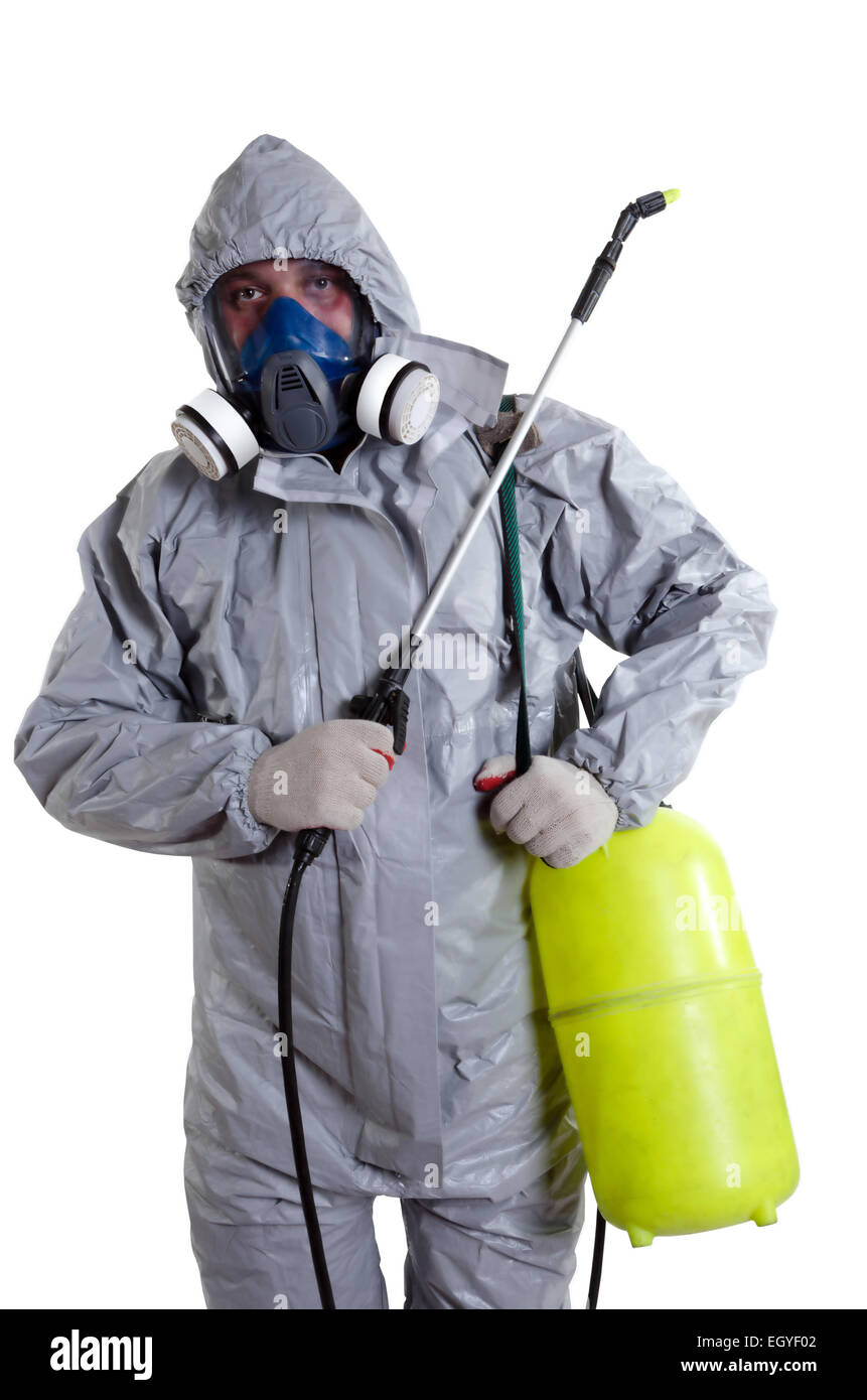 A pest control worker wearing a mask, hood, protective suit and dual ...