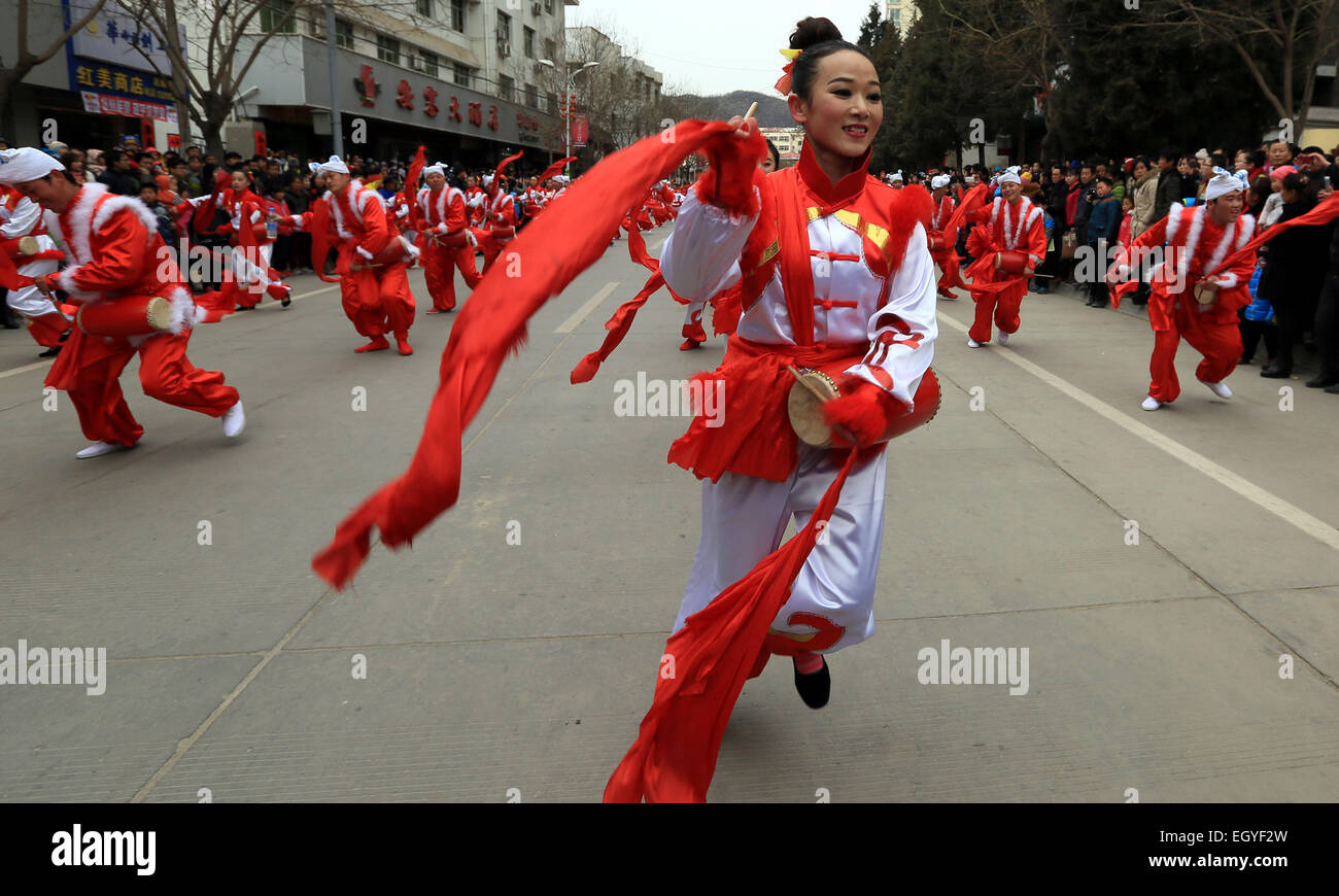 Yan'an. 4th Mar, 2015. Dancers perform waist drum dance during a parade ...