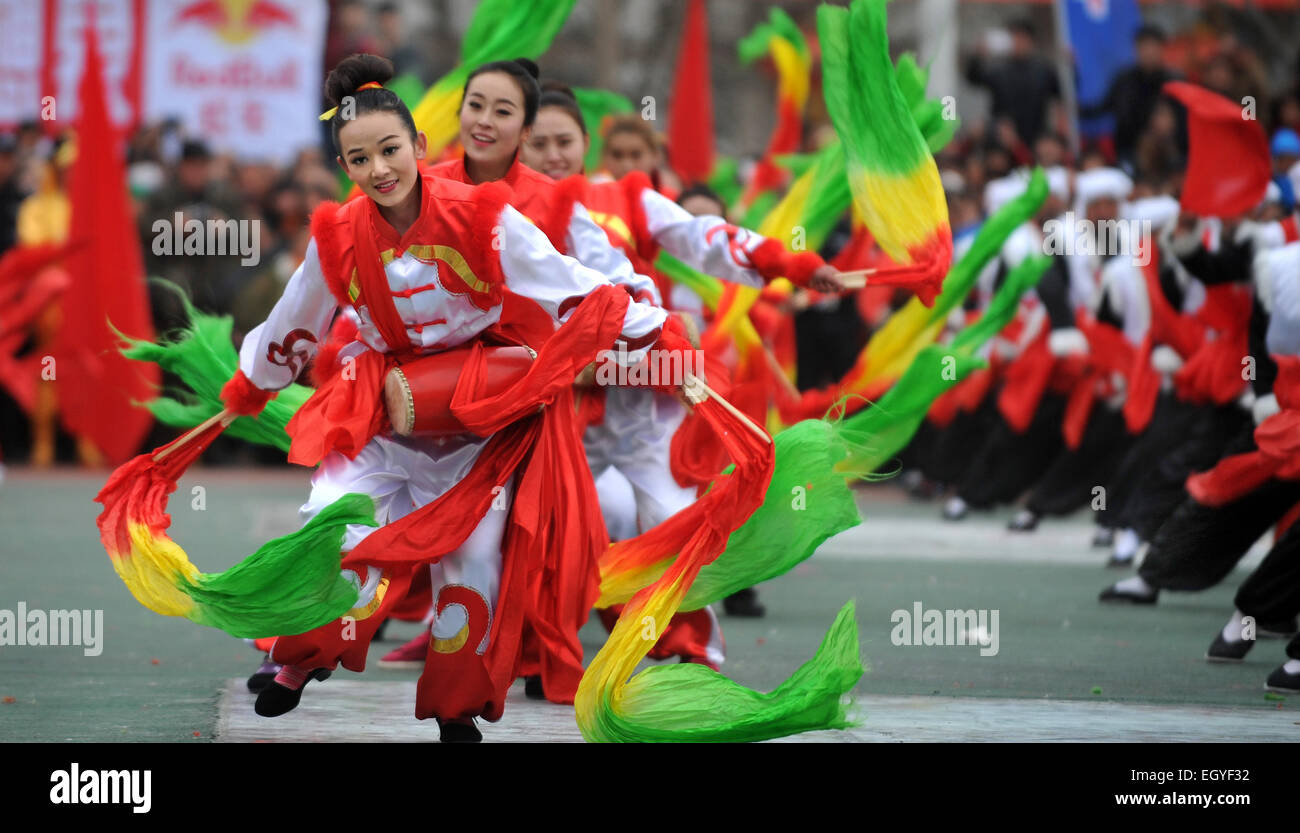 Yan'an. 4th Mar, 2015. Dancers perform waist drum dance during a parade ...
