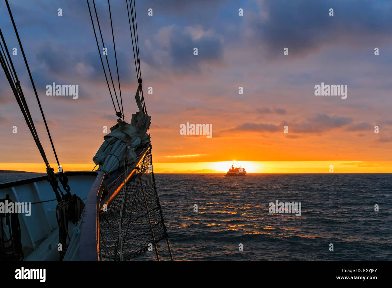 Pacific Ocean, sailing ship at Galapagos Islands at sunrise Stock Photo ...