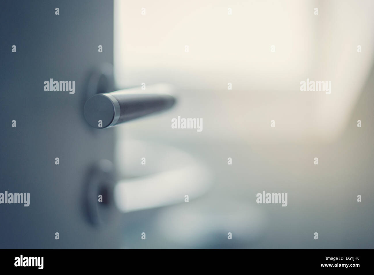 Doorknob of open bathroom door Stock Photo - Alamy