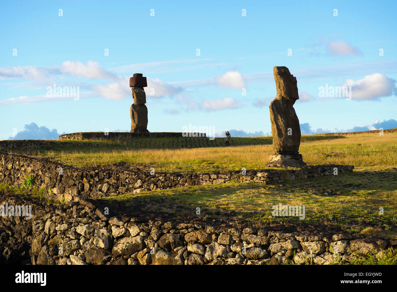 Easter Island, Hanga Roa, Traveller and Moai stone figurines in the ...