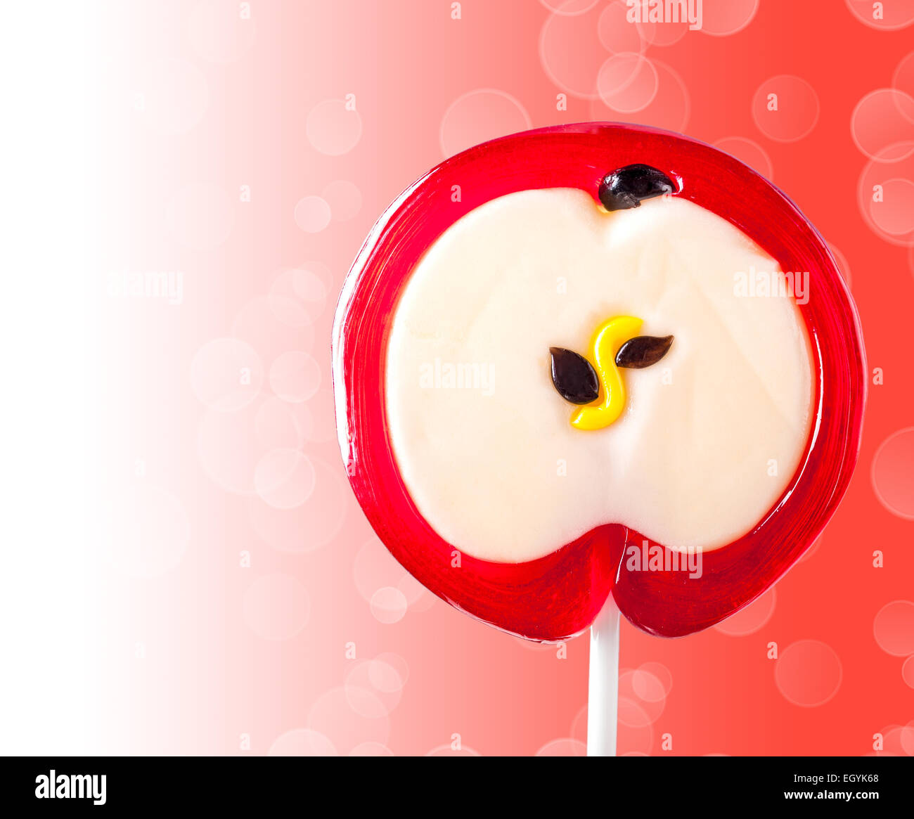 lollipop in the form of an apple on a pink background Stock Photo - Alamy