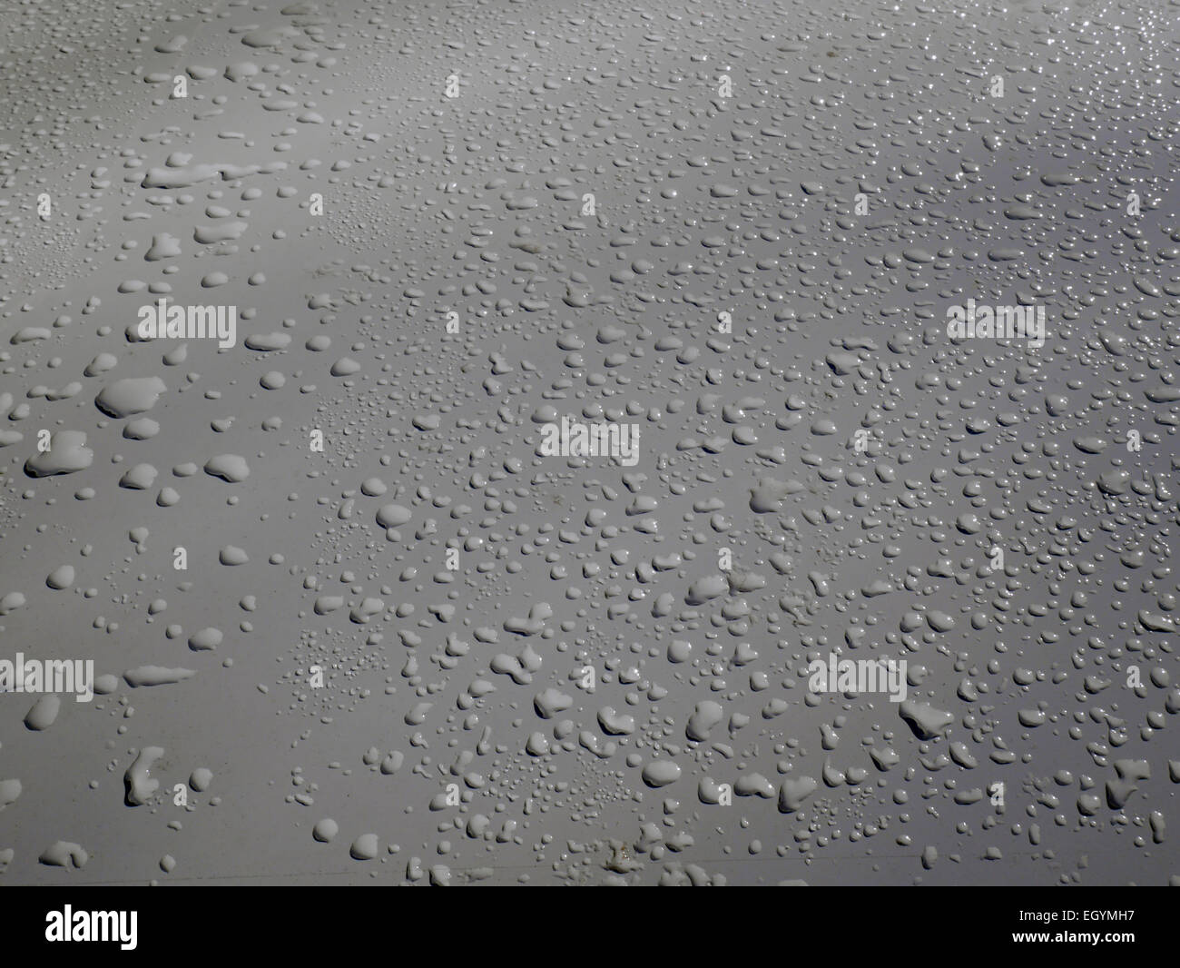 Drops of water on grey surface Stock Photo - Alamy