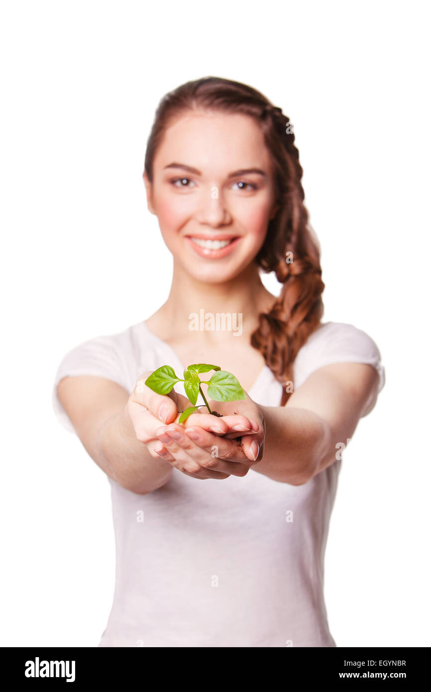 sprout in female hand. woman holding green young sprout and ground ...