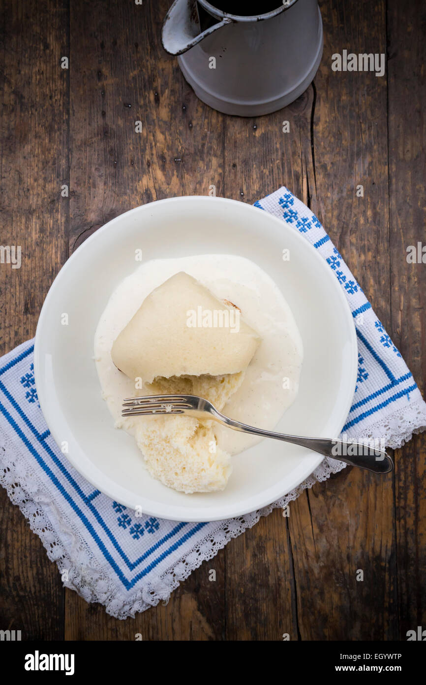 Yeast dumpling with vanilla sauce Stock Photo - Alamy