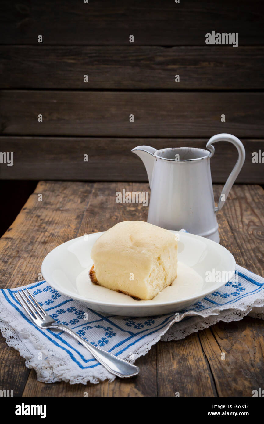 Yeast dumpling with vanilla sauce Stock Photo - Alamy