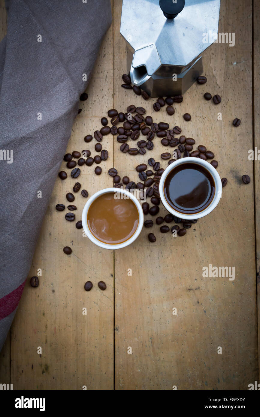 Two cups of coffee, cloth, espresso can and coffee beans Stock Photo ...