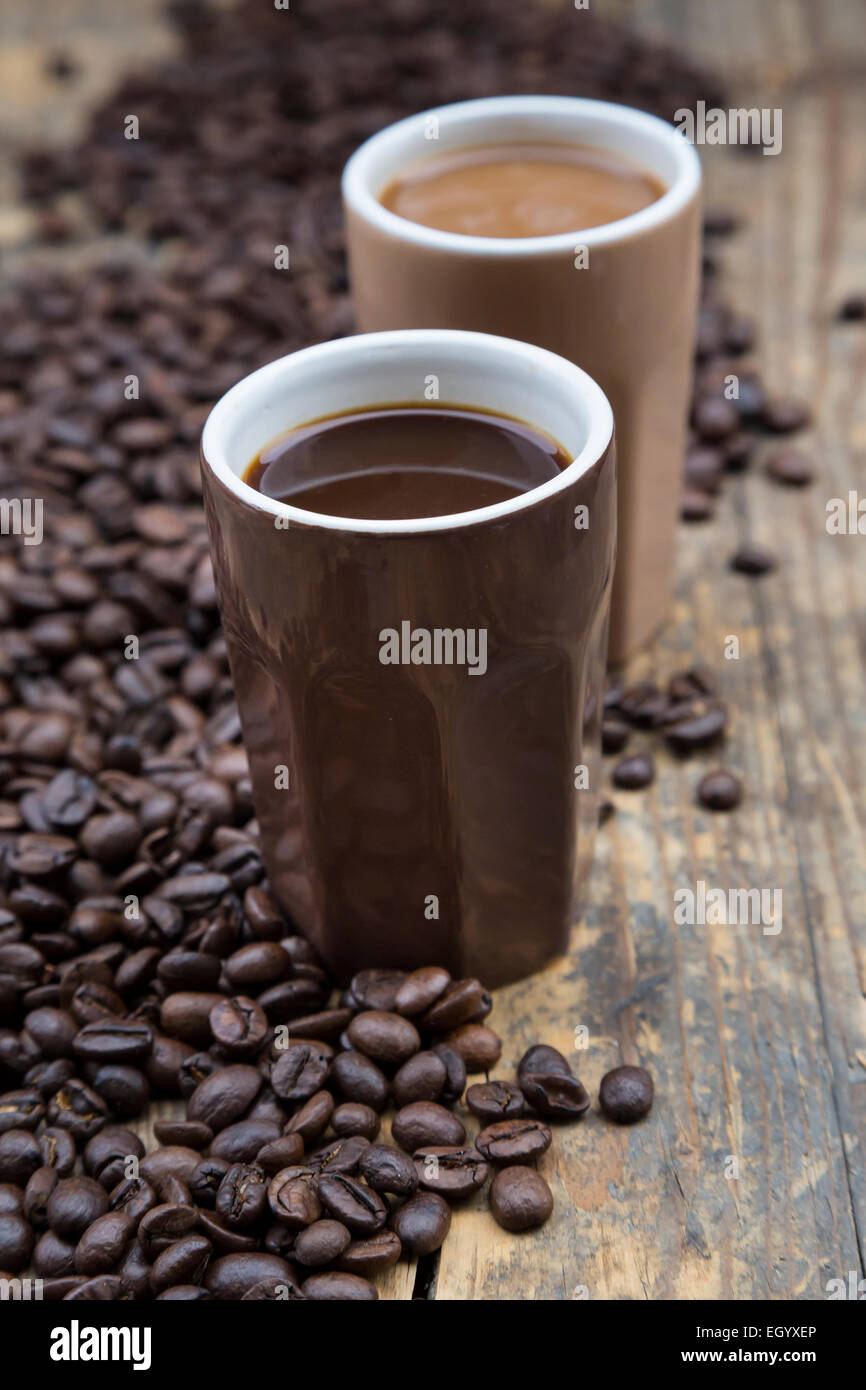 Two cups of coffee and coffee beans Stock Photo - Alamy