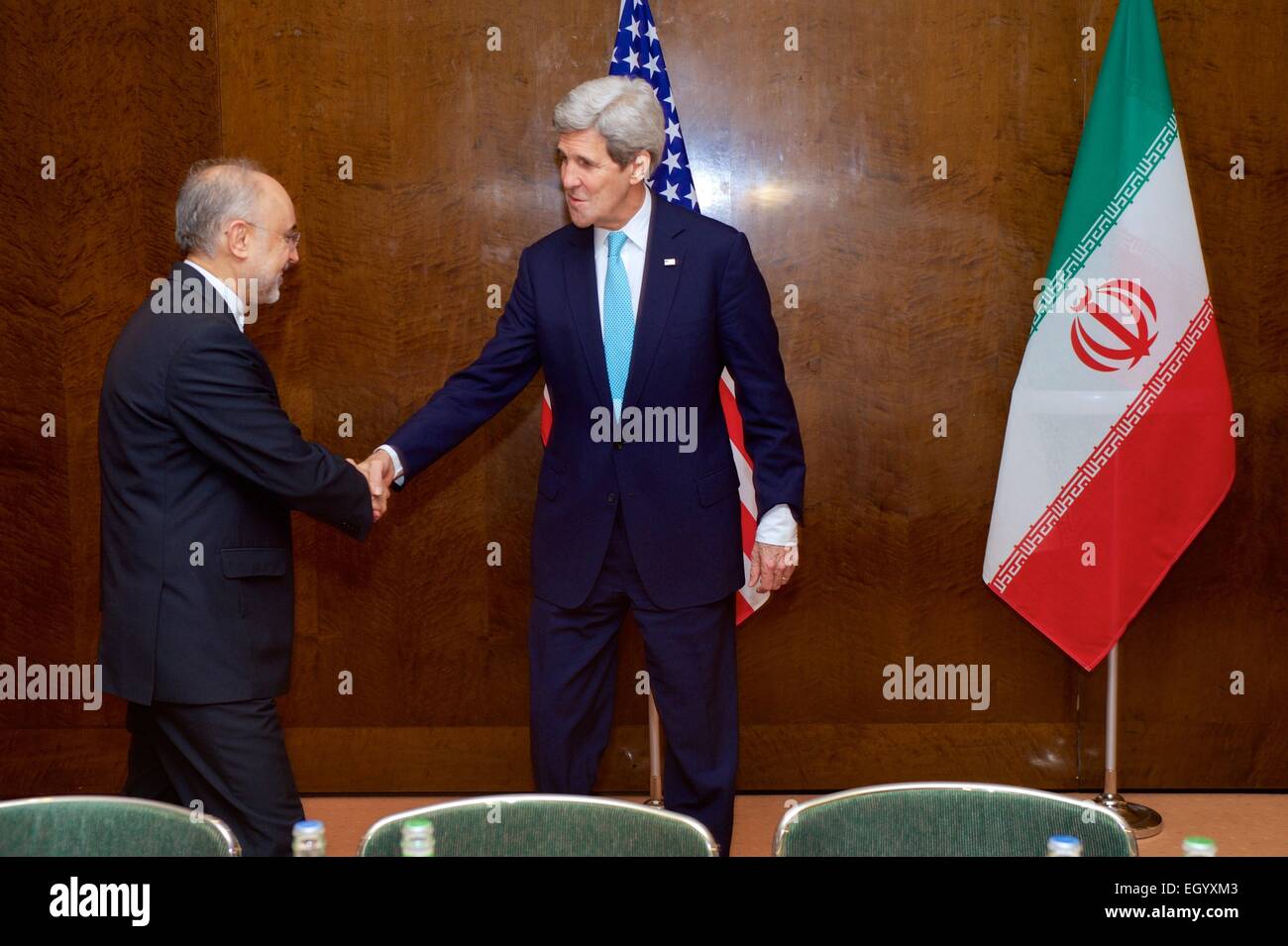 US Secretary of State John Kerry shakes hands with Dr. Ali Akbar Salehi ...