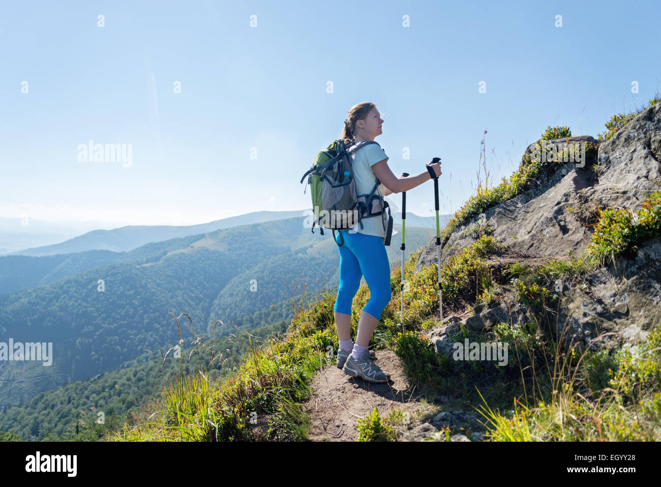 Young woman hiking in the mountains Stock Photo - Alamy