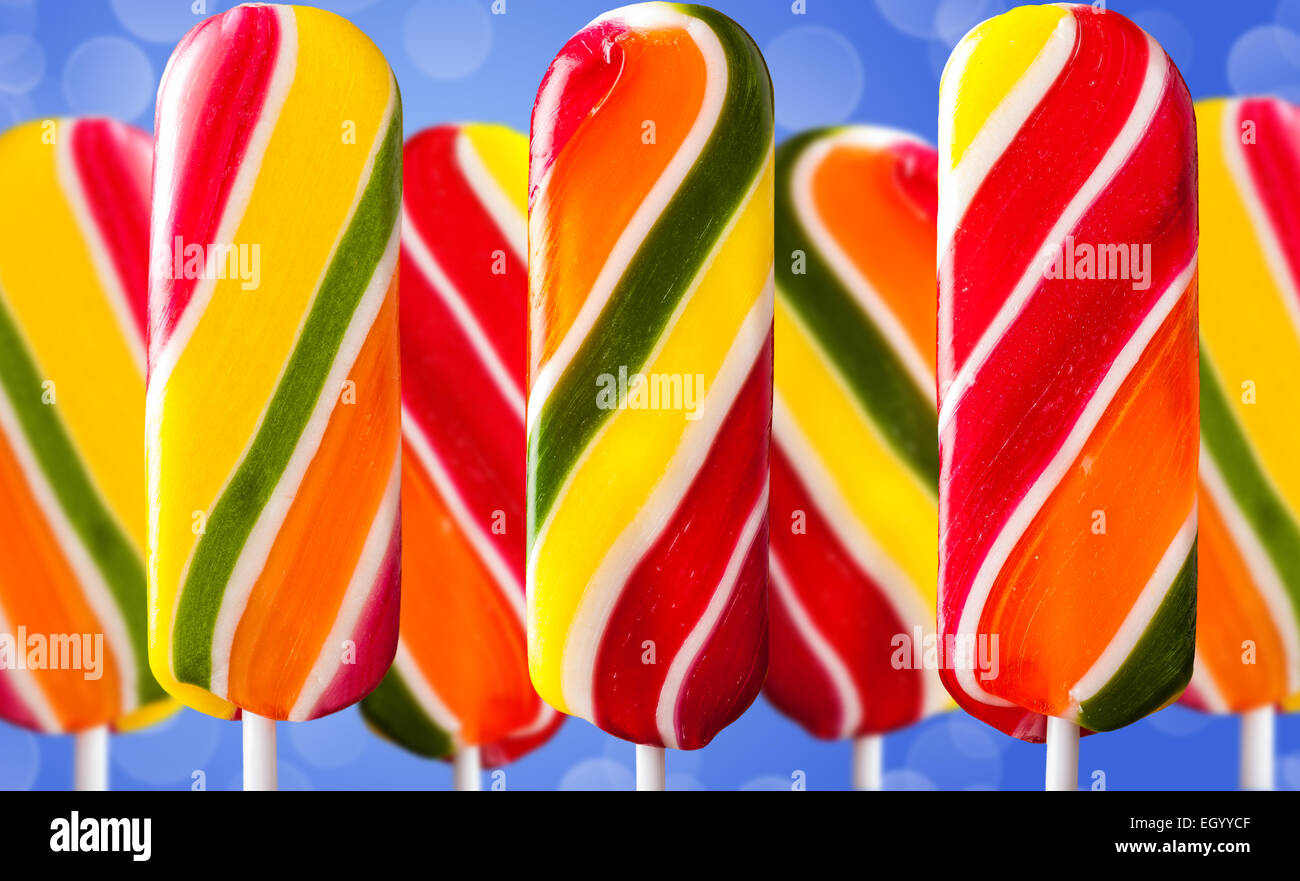 colorful candy sweet closeup on blue background Stock Photo - Alamy