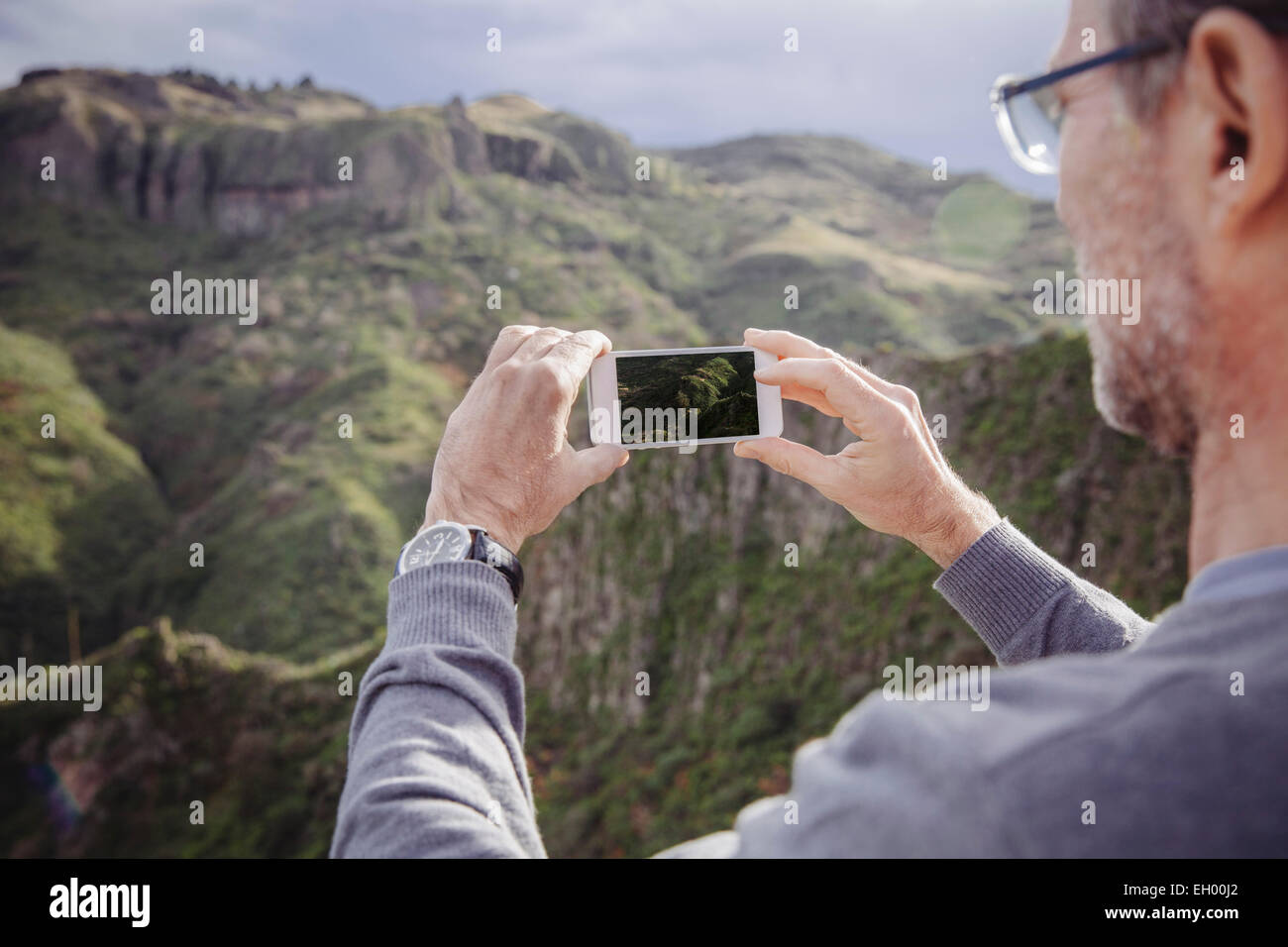 Spain, Canary Islands, Gran Canaria, man taking picture of Vega de San ...