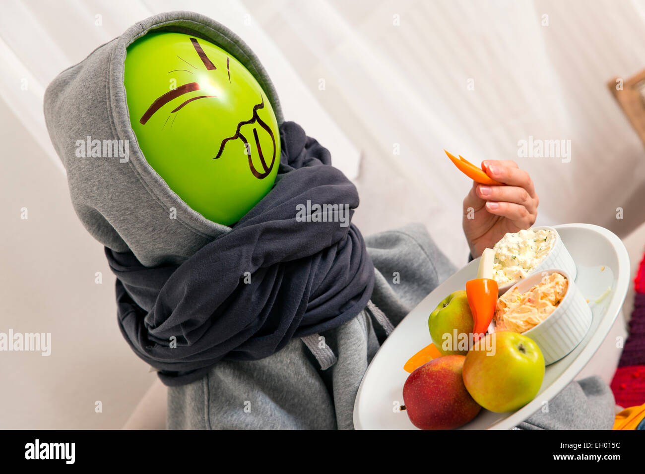 Balloon person find fruits and vegetables disgusting Stock Photo - Alamy