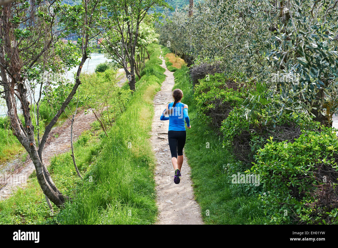 Italy, Trentino, woman running near Lake Garda Stock Photo - Alamy