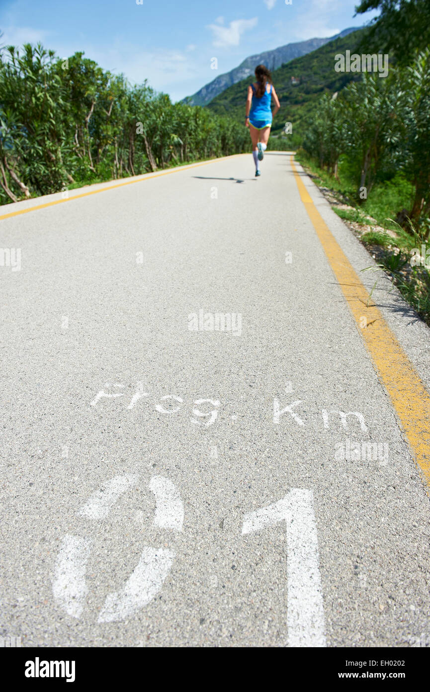 Italy, Trentino, woman running near Lake Garda Stock Photo - Alamy