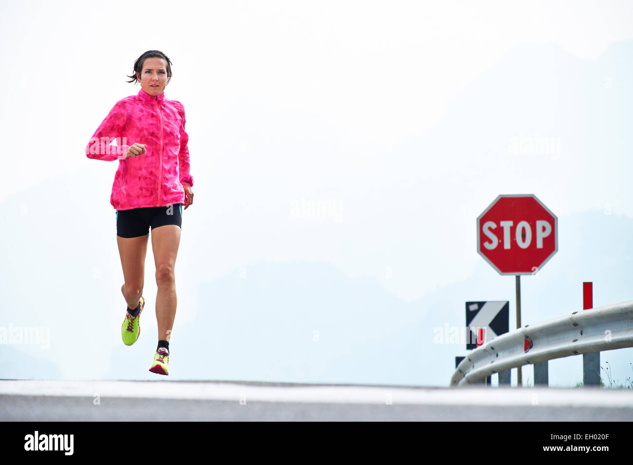 Italy, Trentino, woman running on road near Lake Garda Stock Photo - Alamy