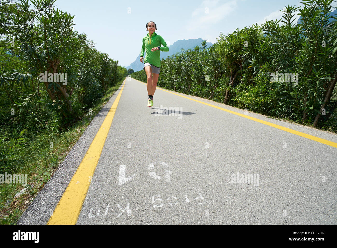 Woman running near lake garda hi-res stock photography and images - Alamy