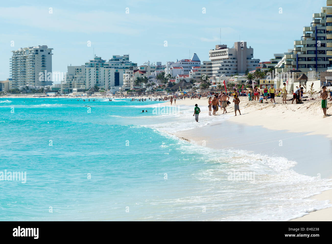 Tourists enjoy the sunny weather and relaxing on the beautiful beach in ...