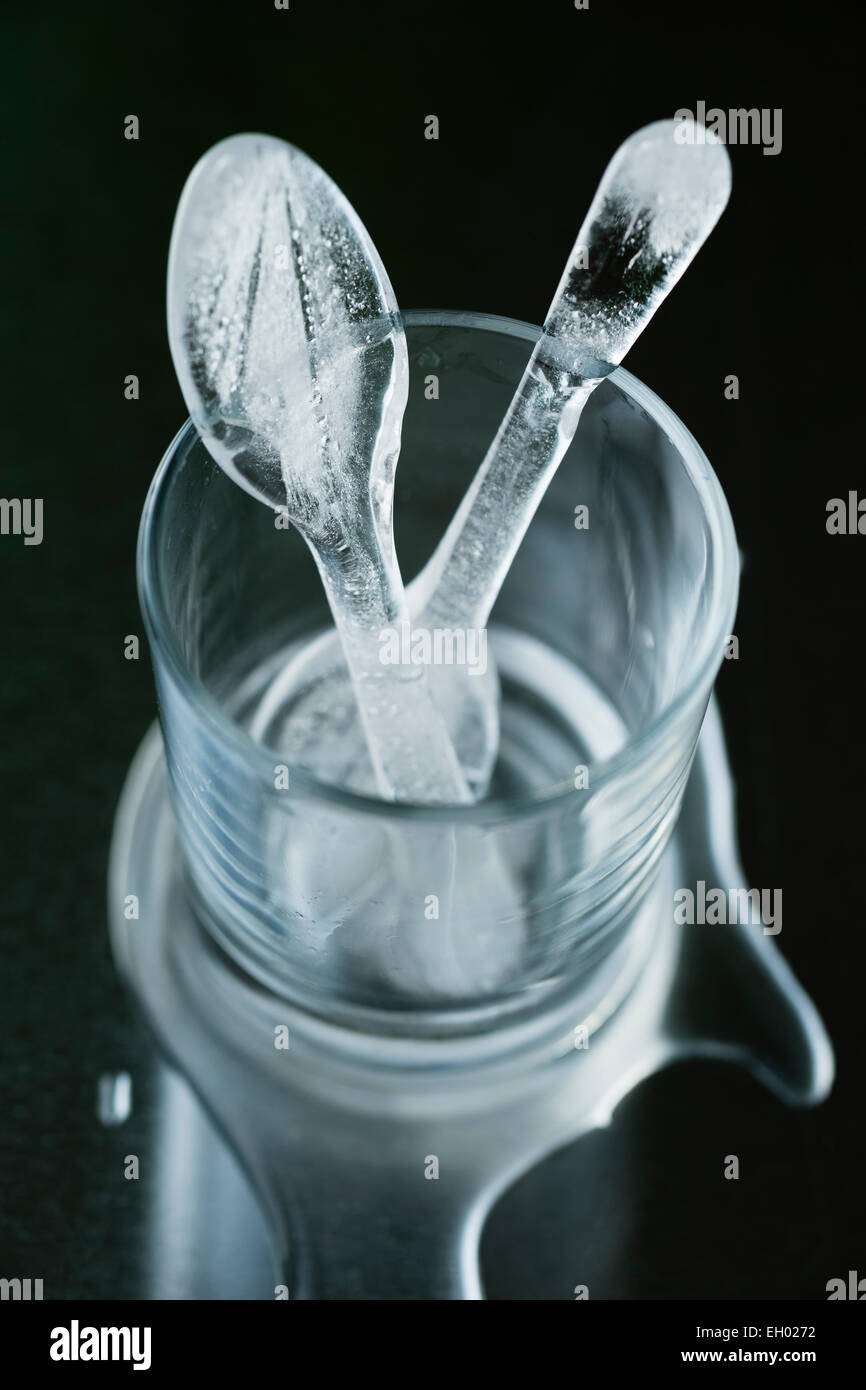 Glass with ice formed like spoons Stock Photo - Alamy