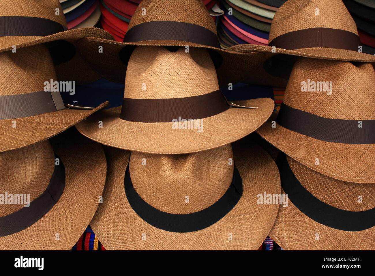 Handmade panama hats stacked for sale at the outdoor craft market in ...