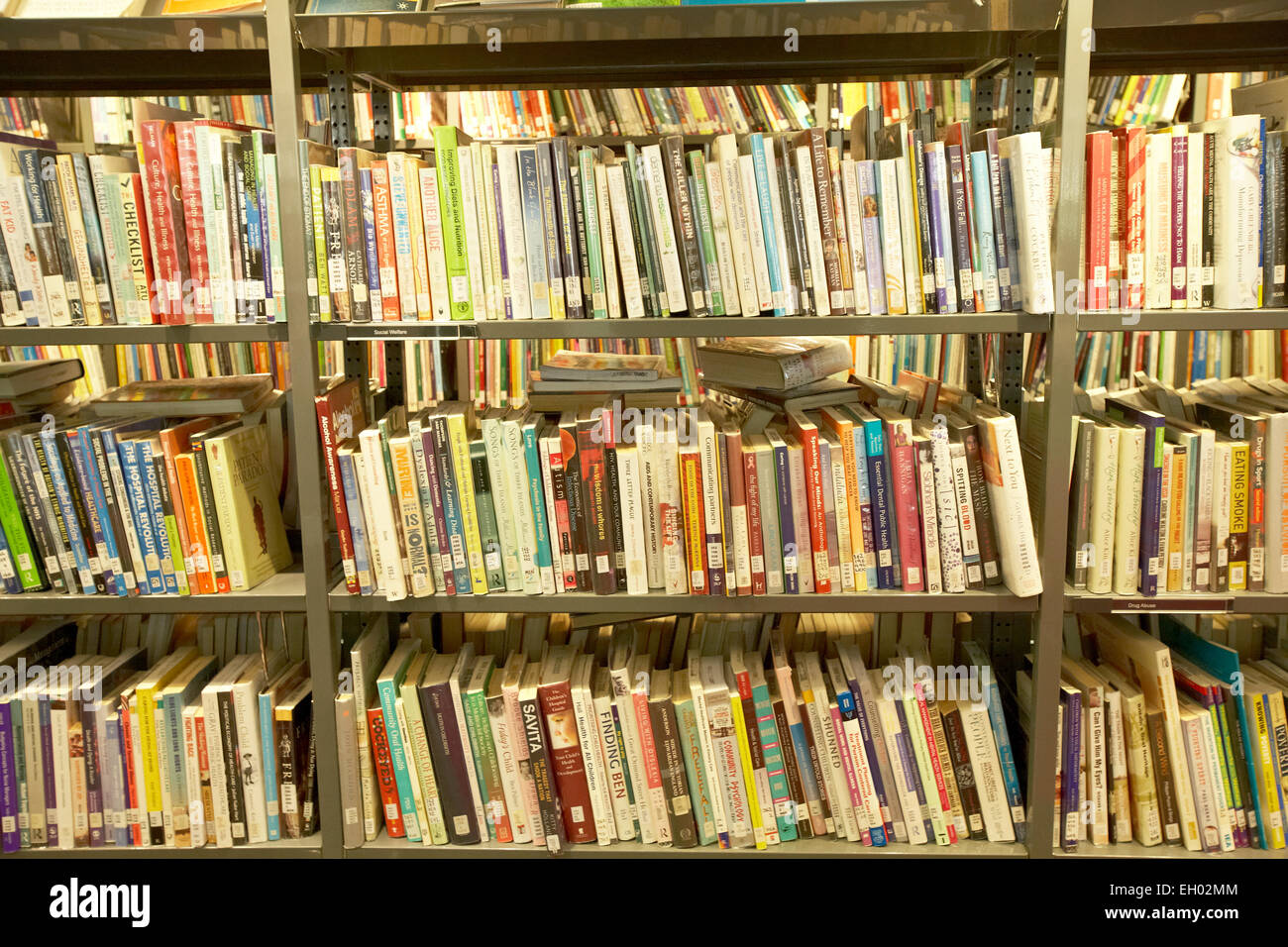 Library books on shelves UK Stock Photo - Alamy