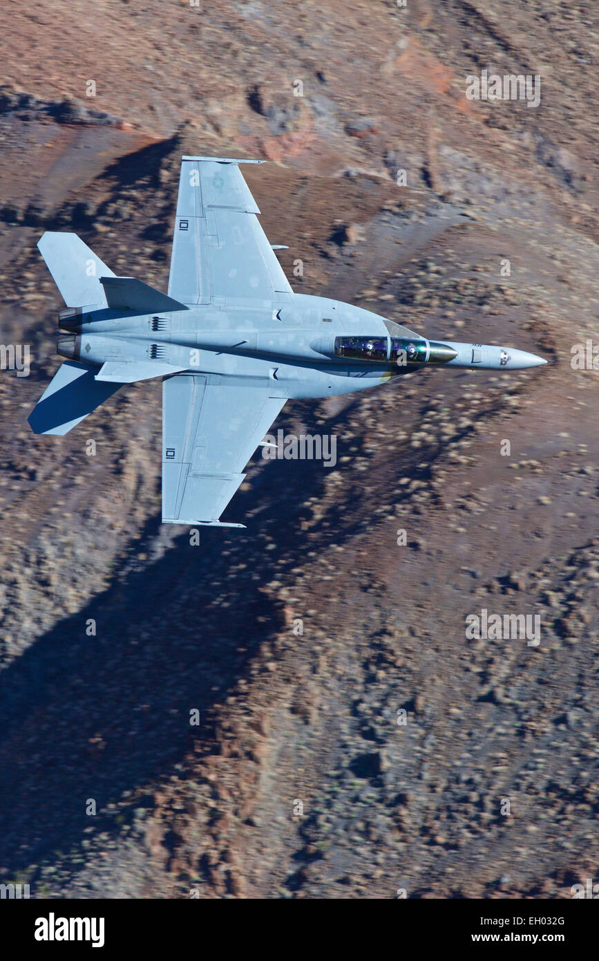 United States Navy F-18 Super Hornet, Flying At Low Level Through A ...