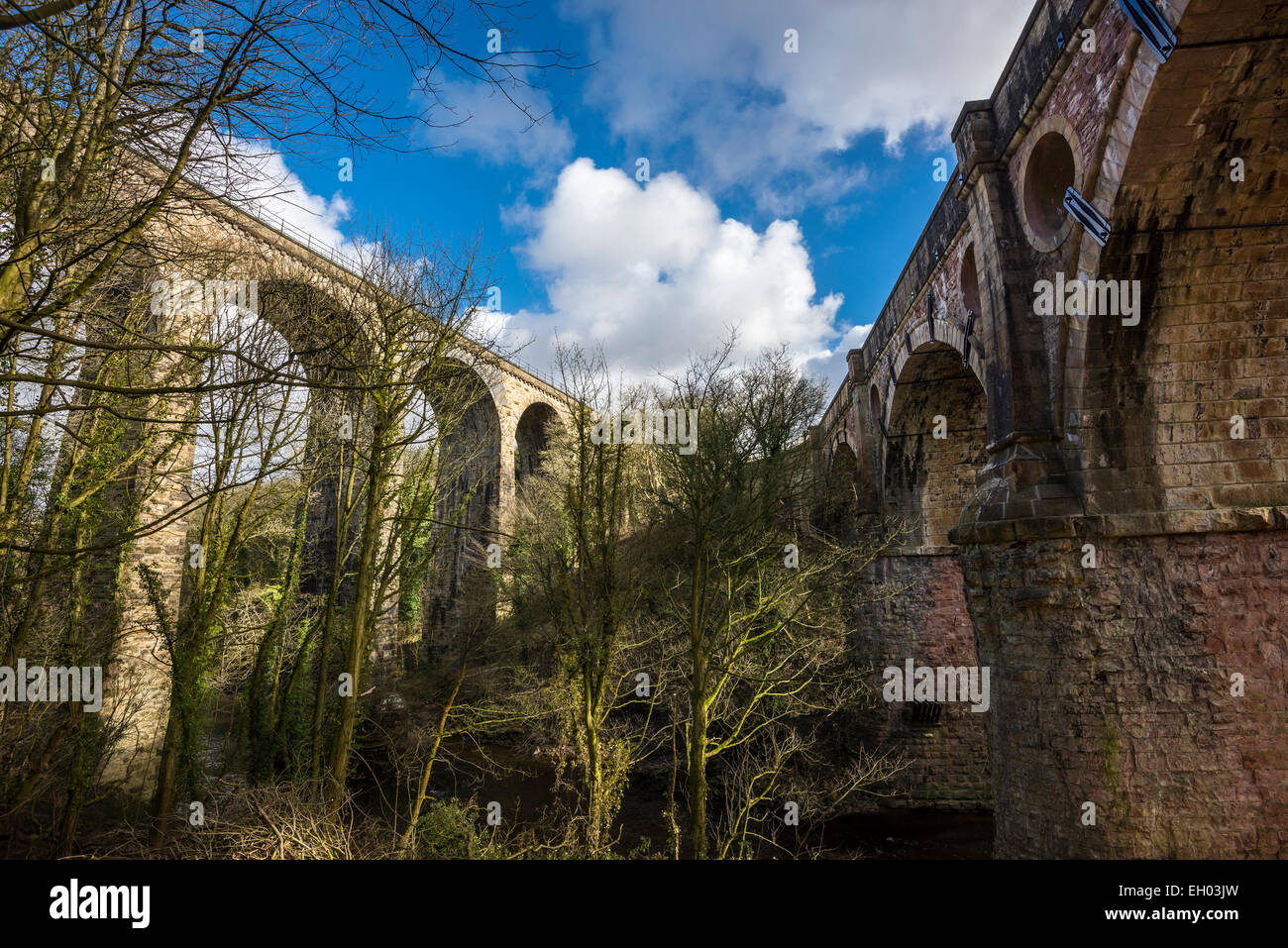 Two bridges at Marple in Greater Manchester. Railway bridge to the left ...