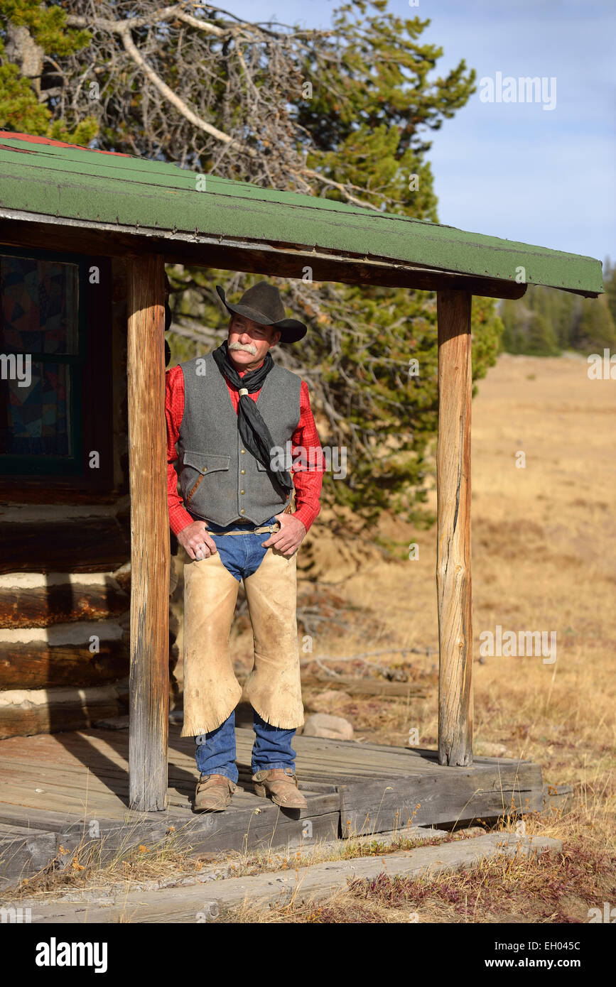 USA, Wyoming, cowboy standing under a porch Stock Photo - Alamy