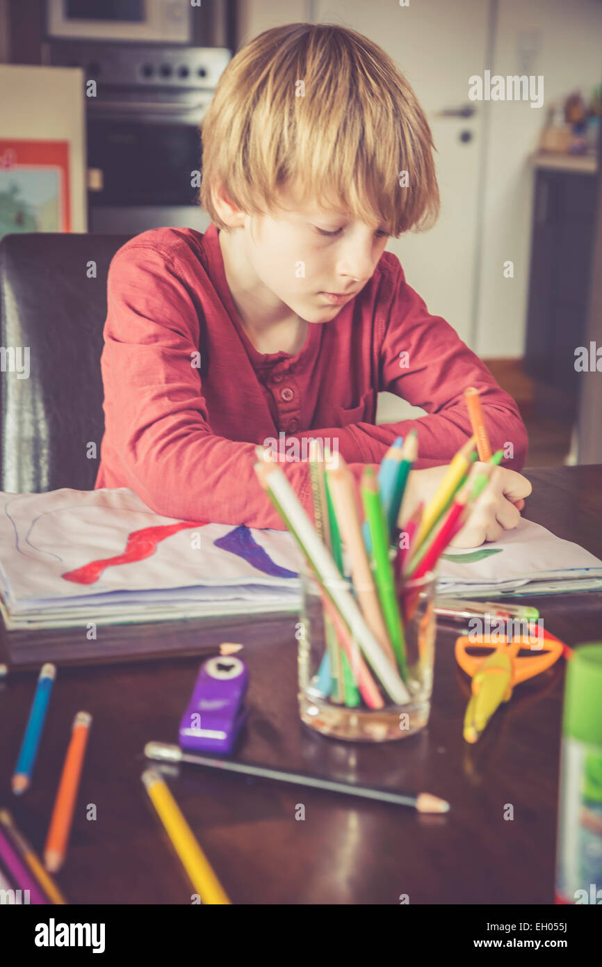 Boy drawing at home Stock Photo - Alamy