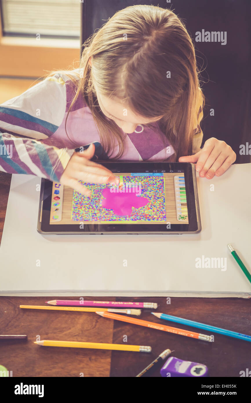 Little girl using digital tablet for drawing Stock Photo - Alamy