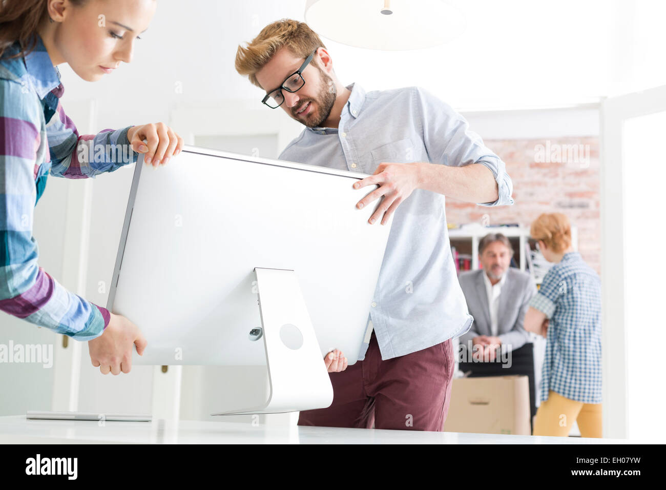 Man carrying computer screen hi-res stock photography and images - Alamy