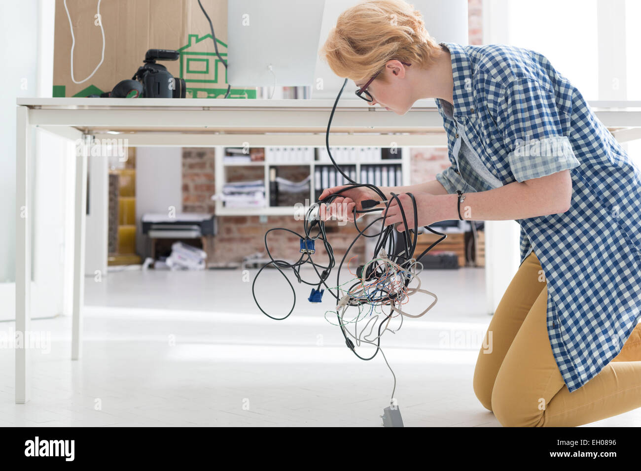Young woman in office connecting computer screen Stock Photo - Alamy