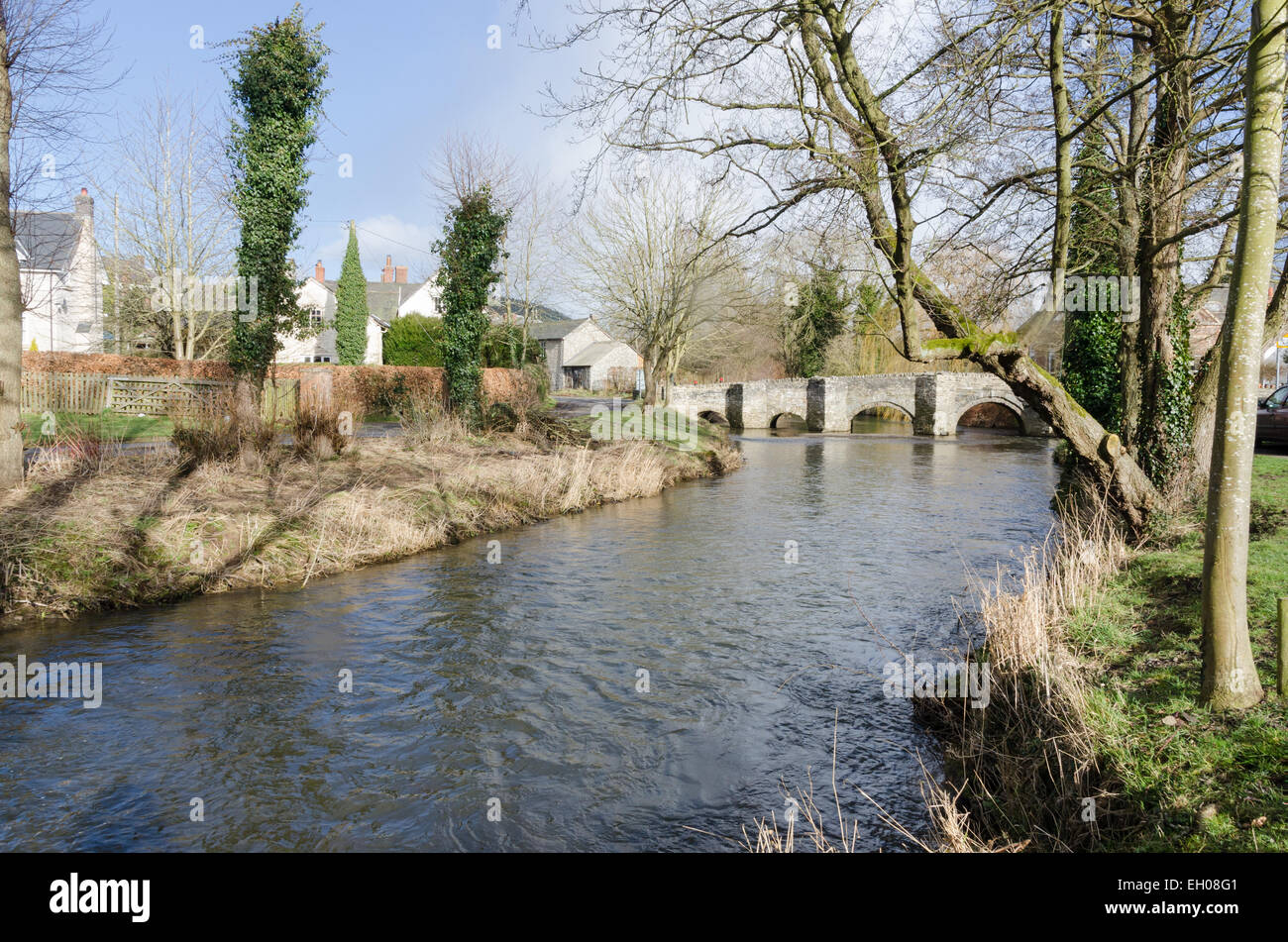 The River Clun flowing through the small Shropshire town of Clun Stock ...
