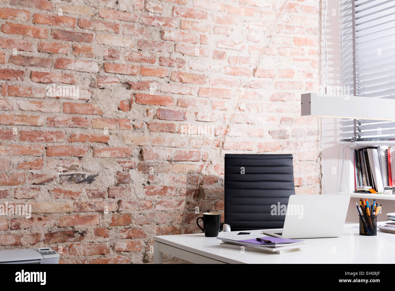 Laptop on desk in office Stock Photo - Alamy