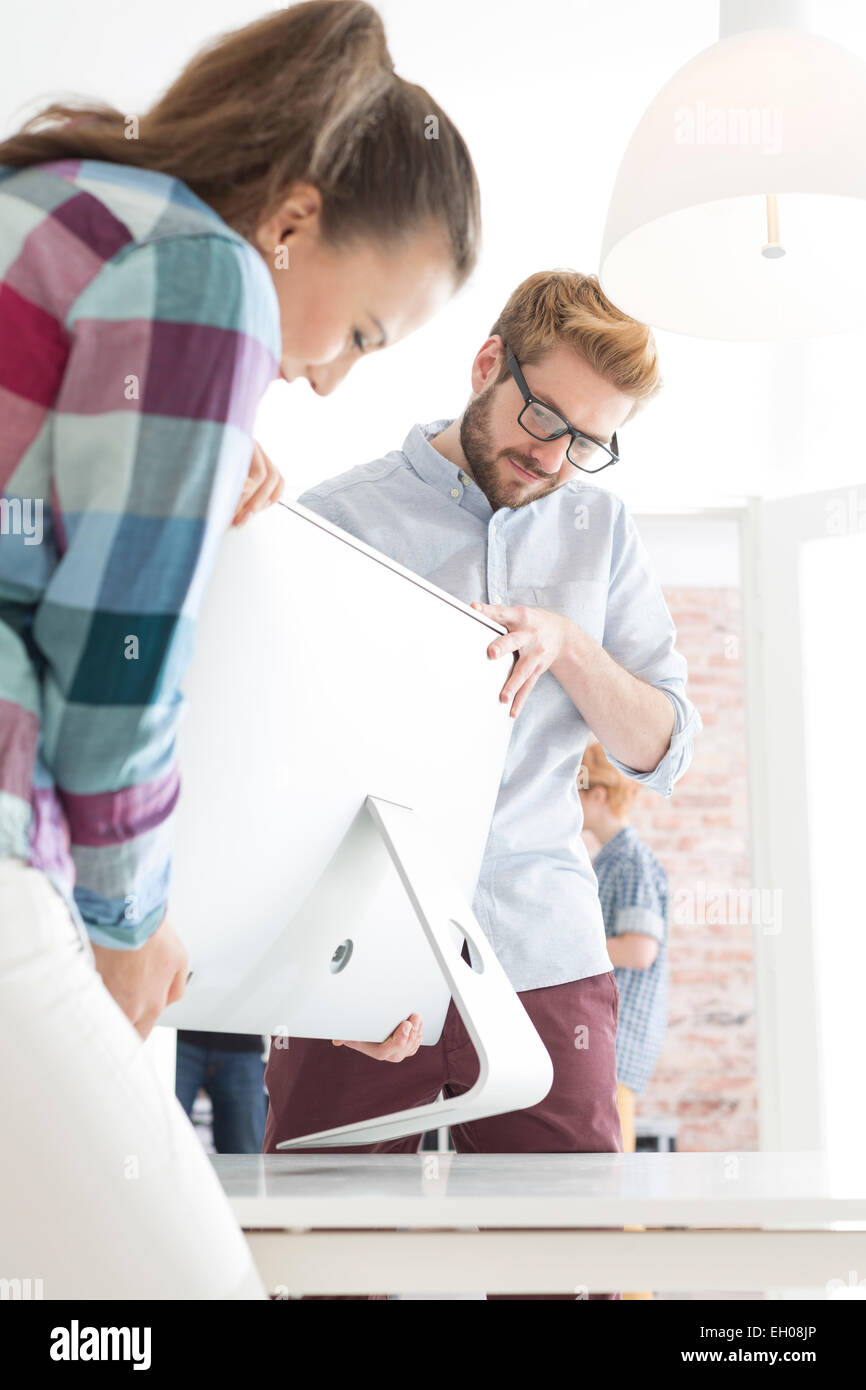 Woman carrying computer monitor hi-res stock photography and images - Alamy