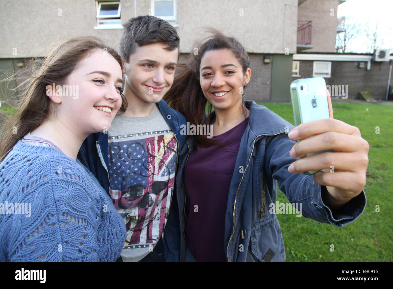 Teenagers taking selfie with mobile phone - model released Stock Photo ...