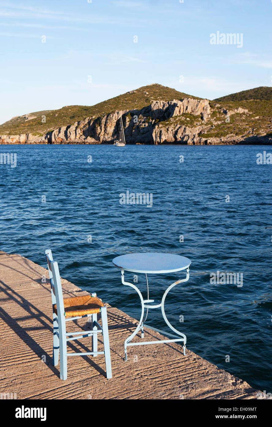 Greece, Limenas Geraka, chair and table at the Sea Stock Photo - Alamy