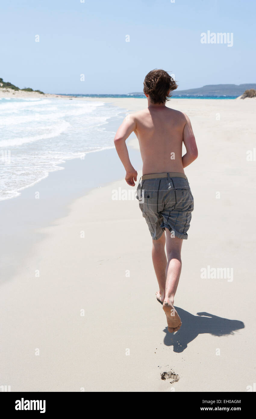 Man running at the beach hi-res stock photography and images - Alamy