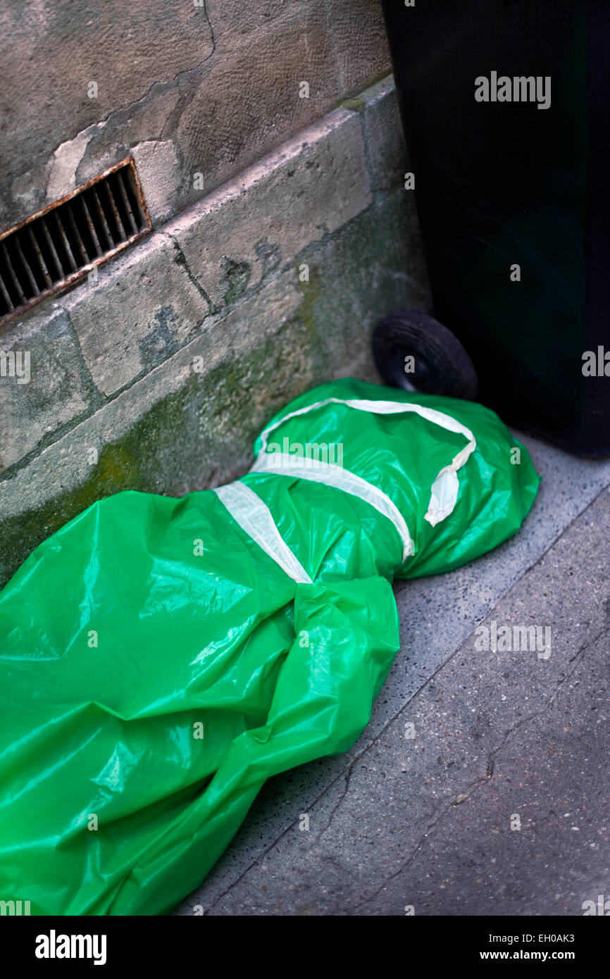 Plastic packaging on a sidewalk in town Stock Photo - Alamy
