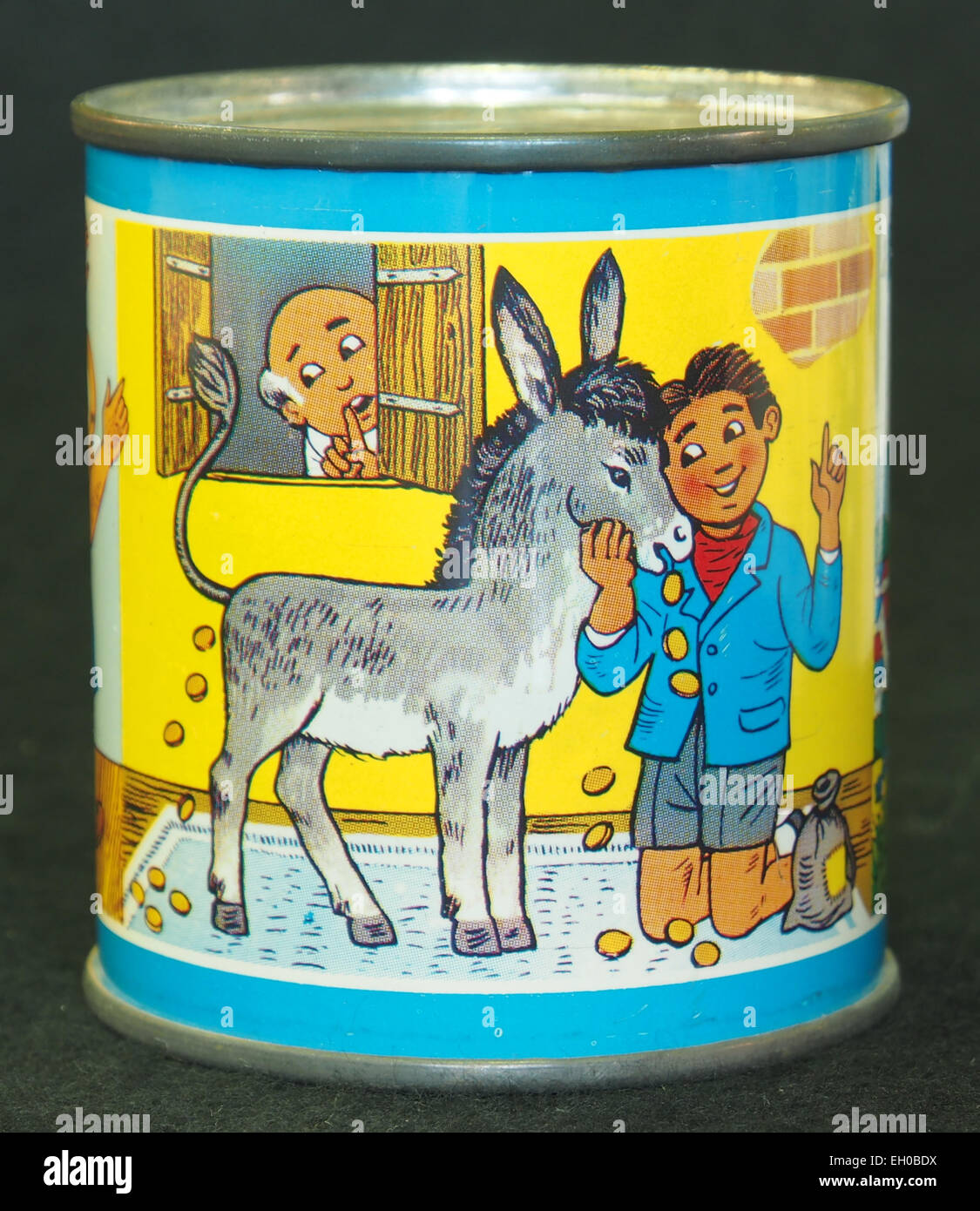 This image features a metal piggy bank (blikken spaarpotje) with a ...