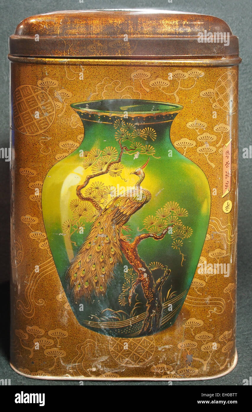 The image shows a Chinese tin can, often used for packaging food ...