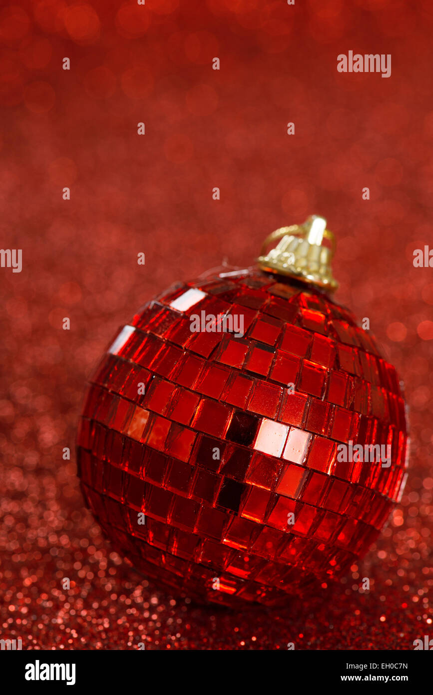Red christmas ball on red background Stock Photo - Alamy